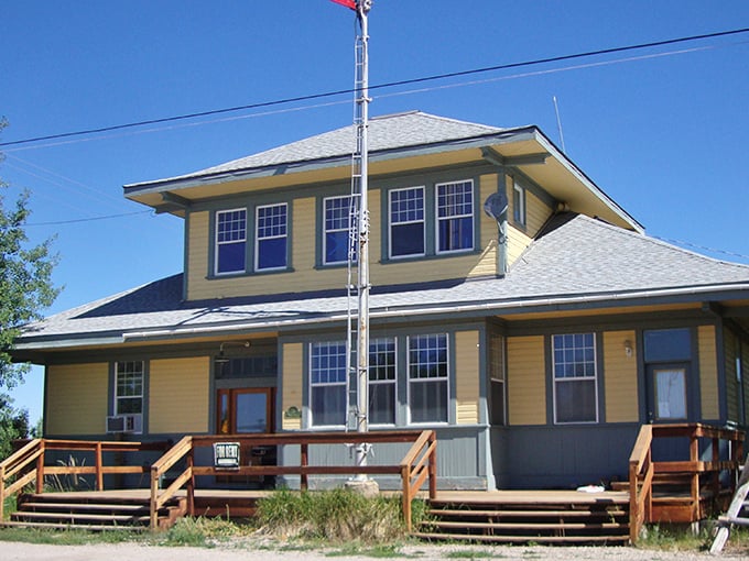 This charming yellow depot building stands as a reminder that sometimes the journey matters more than the destination.