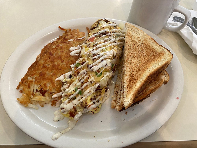 This omelet has more fillings than your average novel, with a side of hash browns that achieved the perfect crisp-to-tender ratio.