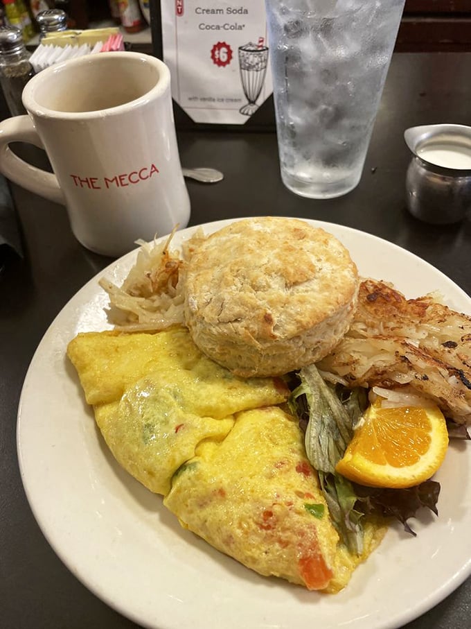 A perfect omelet paired with a flaky biscuit and crispy hash browns&mdash;the holy trinity of breakfast that's worth setting your alarm for.