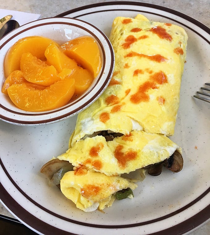 This isn't just an omelet &ndash; it's breakfast architecture. Perfectly folded with a golden exterior that promises (and delivers) deliciousness inside.