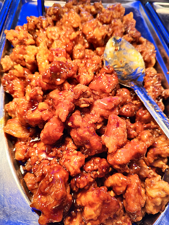 General Tso's chicken &ndash; crispy, glossy, and glistening with that perfect sweet-spicy sauce. The buffet MVP that never disappoints.