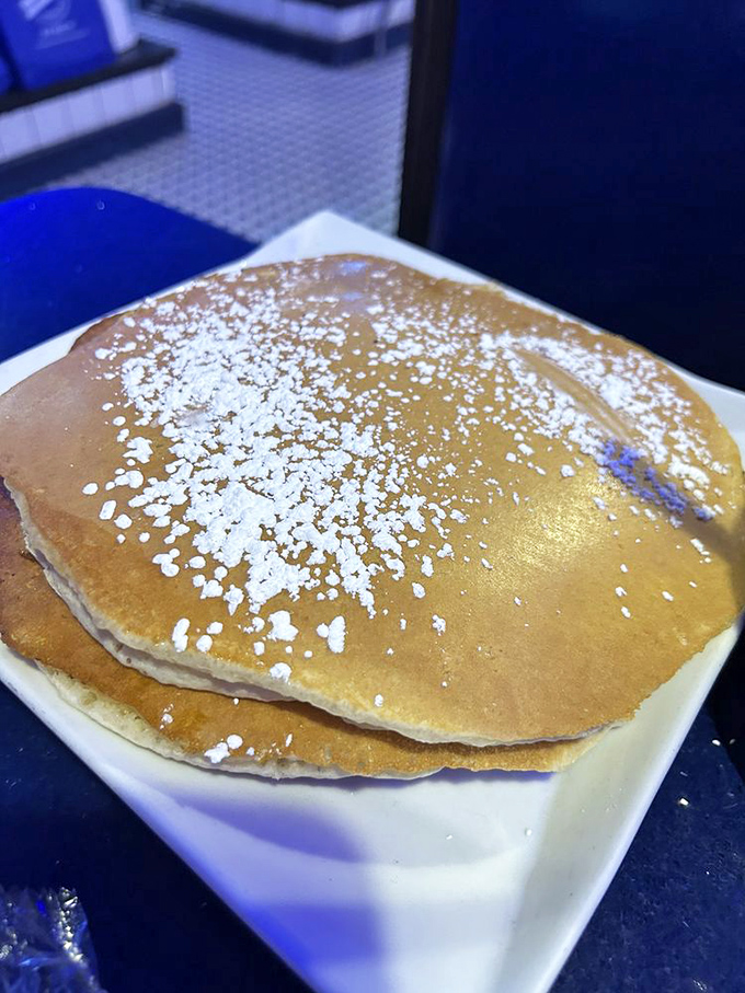 Golden pancakes dusted with powdered sugar&mdash;the kind that make you wonder why we don't eat breakfast for every meal of the day.