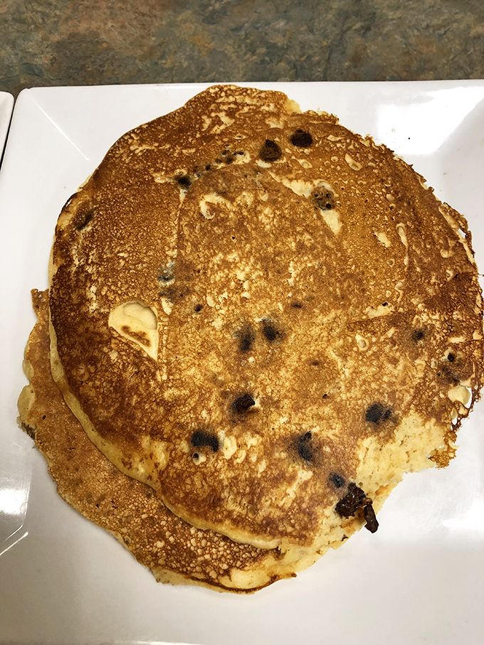 Blueberry pancakes with that perfect golden-brown exterior – the kind that make you wonder why you ever bother making them at home.