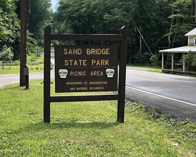 The park's unassuming entrance sign perfectly captures its modest charm. Like finding a Michelin-starred restaurant in a strip mall – the best treasures don't need flashy advertising.