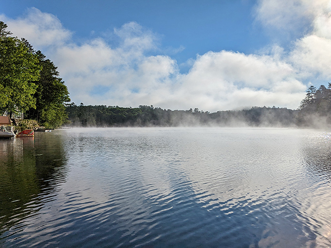 Morning mist hovers over a glassy New Hampshire lake &ndash; nature's way of saying "slow down and breathe" just minutes from downtown.