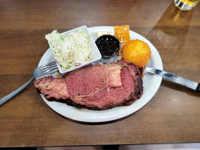 Prime rib that's redder than a South Dakota sunset, paired with creamy coleslaw and a cornbread muffin that's basically dessert in disguise.