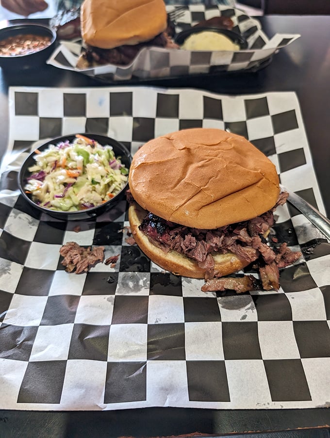 A sandwich that requires both hands and several napkins is always a good sign. This pulled pork masterpiece comes with coleslaw for that perfect crunch contrast.
