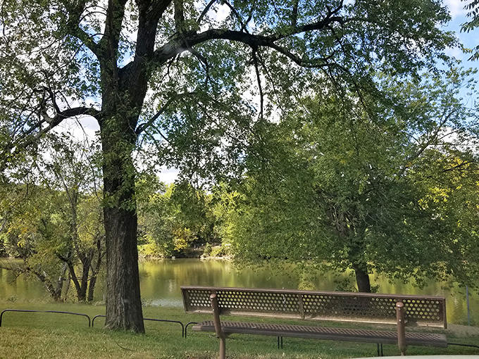A bench with a view worth a thousand words. This peaceful riverside spot proves Kentucky's natural beauty rivals any fancy resort landscape.