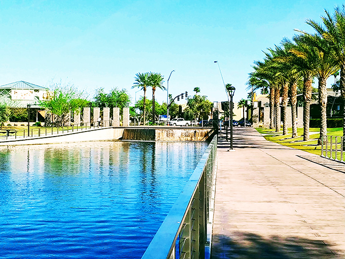 Riverview Park's serene water feature and palm-lined walkways create an urban oasis where locals gather to escape the desert heat.