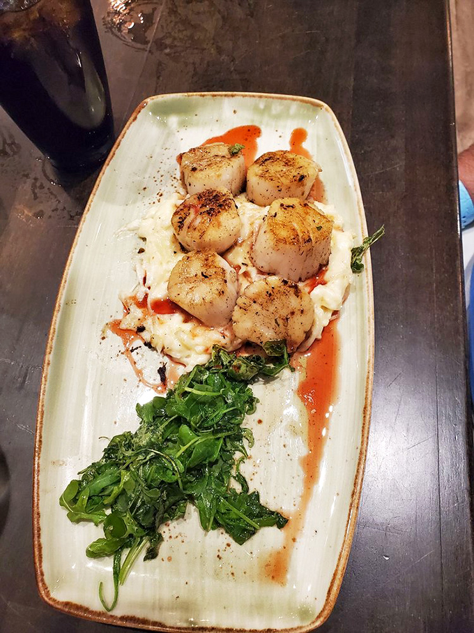 Perfectly seared scallops perched atop risotto like culinary royalty&mdash;these ocean jewels are cooked with the reverence they deserve.