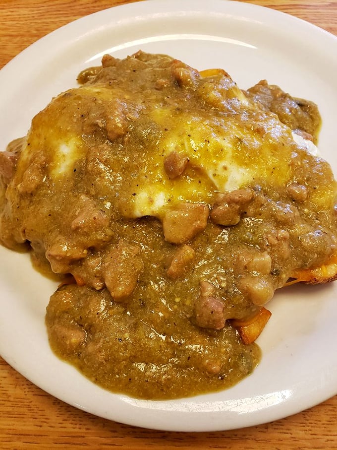 This isn&rsquo;t just breakfast&mdash;it&rsquo;s a skillet stacked with edible architecture. Layers of eggs, potatoes, and sausage gravy form a savory skyscraper of morning delight.