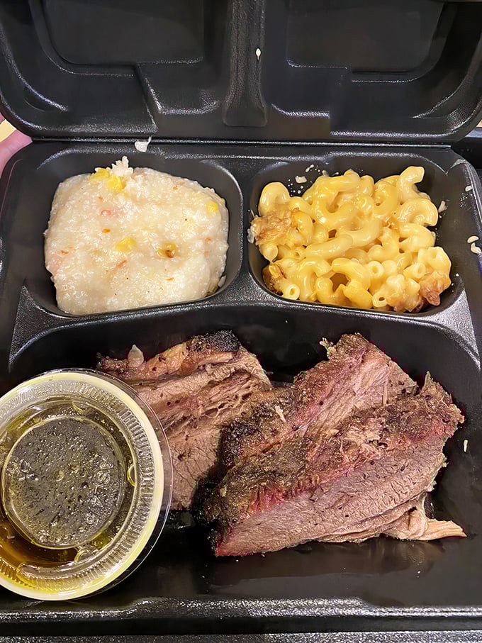 Brisket that shows off its smoke ring like a badge of honor, paired with mac and cheese that's clearly not from a box.