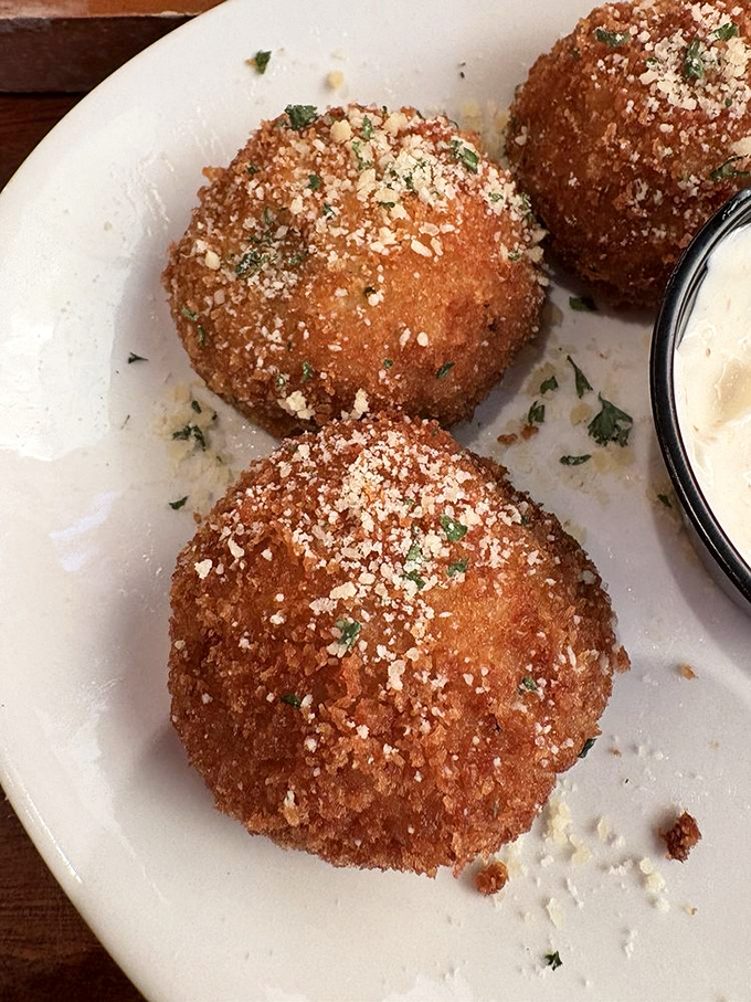 These aren't just stuffed mushrooms&mdash;they're little edible treasure chests dusted with parmesan gold. The dipping sauce is merely a bonus adventure.