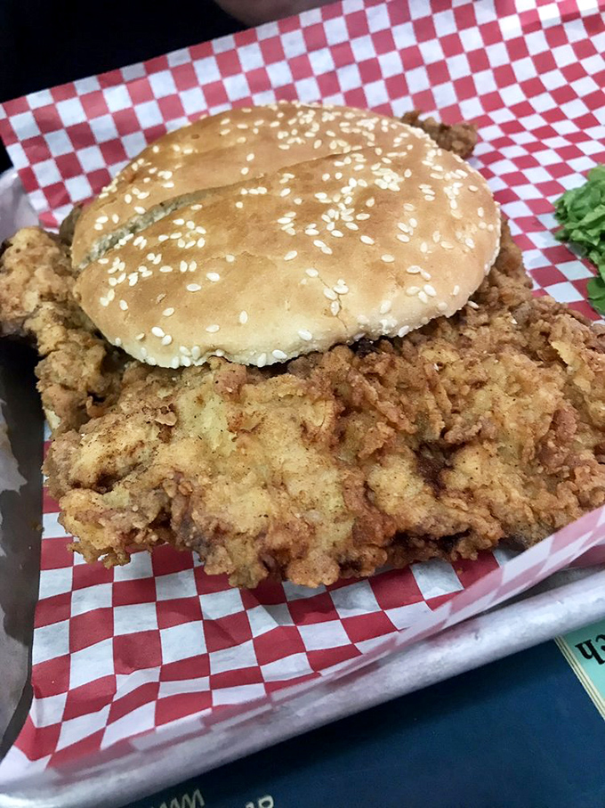 The tenderloin sandwich that laughs at the concept of "bun-to-meat ratio." This golden-fried masterpiece requires a strategy just to tackle it.