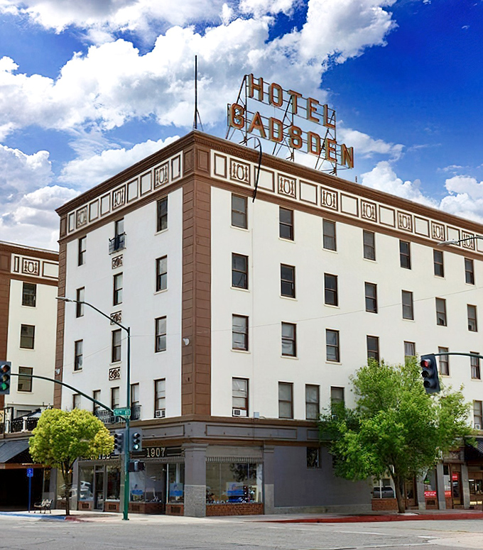 The Gadsden Hotel stands regally against azure skies, its vintage sign promising the same elegance that greeted guests a century ago.