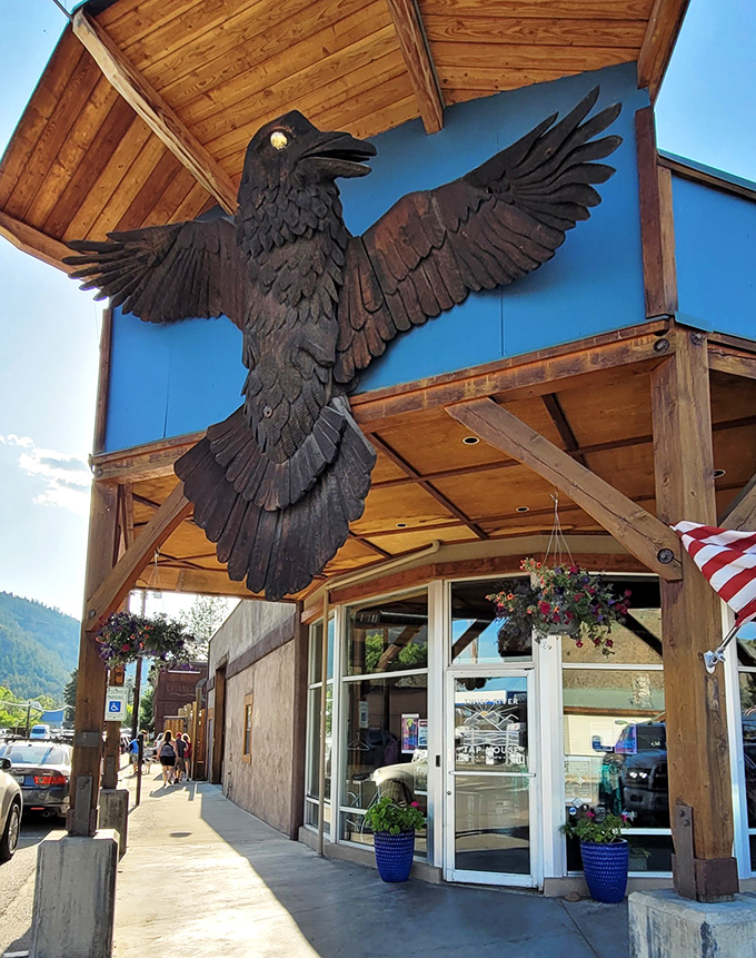 That magnificent wooden raven isn't just art&mdash;it's a guardian watching over Twisp's storefronts. Local craftsmanship that stops visitors in their tracks.