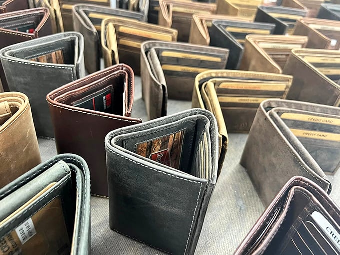 A leather wallet convention where each one silently promises to be the one that finally organizes your life. Spoiler alert: it won't.