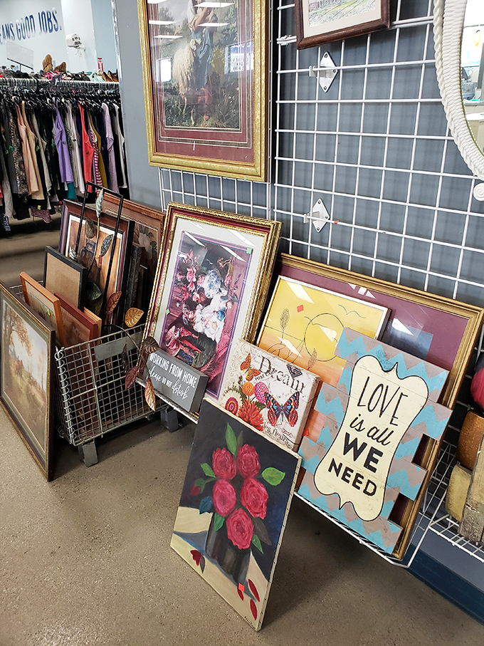 Wall art for every taste lines the display&mdash;from classic landscapes to motivational messages declaring that "Love is all we need."