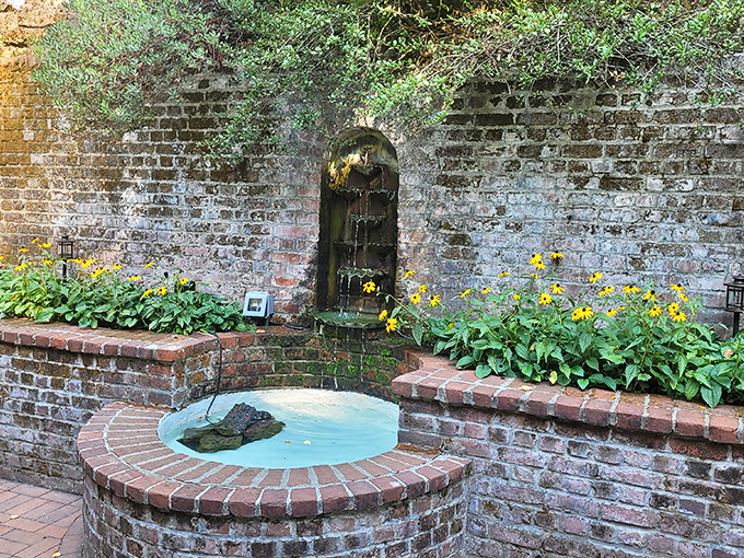 A charming brick fountain surrounded by black-eyed Susans proves that simple elegance never goes out of style.
