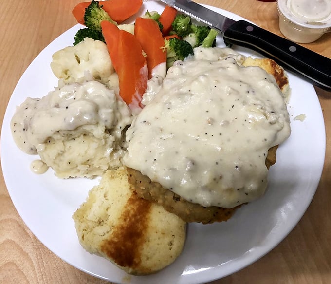 Country-fried comfort under a blanket of peppery gravy, with sides that know their supporting role but still manage to shine.