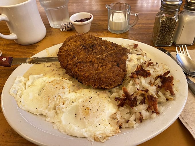 The chicken fried steak &ndash; a masterclass in comfort food engineering. Crispy coating, tender meat, and eggs that somehow make this a "breakfast" rather than what it really is: joy on a plate.