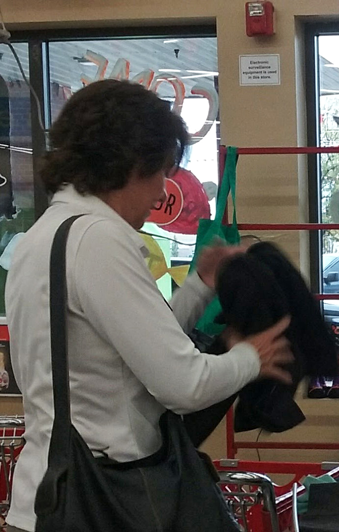 The shopper's intense focus says it all&mdash;thrifting is serious business when designer labels might be hiding in plain sight.