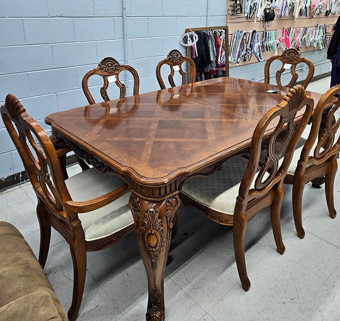 Dinner for six, served with a side of ornate craftsmanship. This dining set isn't just furniture; it's an heirloom waiting for its next family.