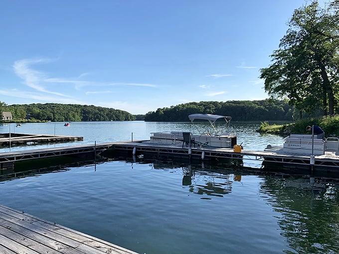 Boat slips waiting patiently like loyal steeds, ready to carry modern-day explorers across waters that reflect both sky and ambition.