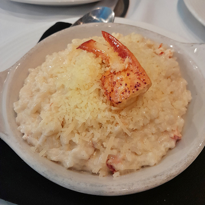 Lobster risotto that whispers "treat yourself" with each creamy, decadent bite. That single shrimp on top is like the cherry on a very sophisticated sundae.