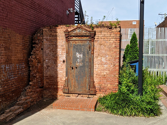 This weathered bank vault door stands as a testament to history&mdash;guarding nothing now but memories and serving as the ultimate conversation piece.