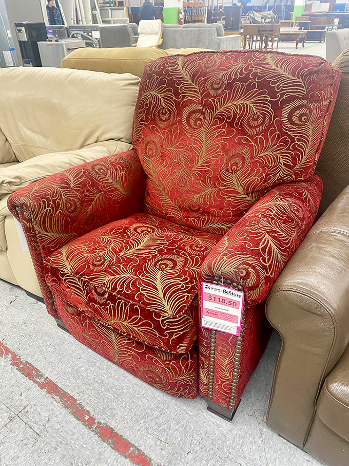 A regal red armchair fit for royalty&mdash;or just for reading the Sunday paper. That peacock pattern practically demands a cup of tea.