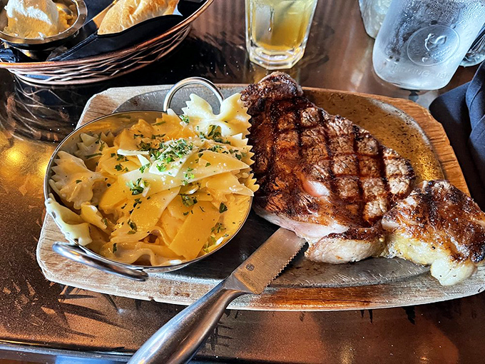 The ribeye arrives with buttery pasta that's clearly been taking lessons in how to upstage a perfectly grilled steak. Spoiler alert: the steak still wins.