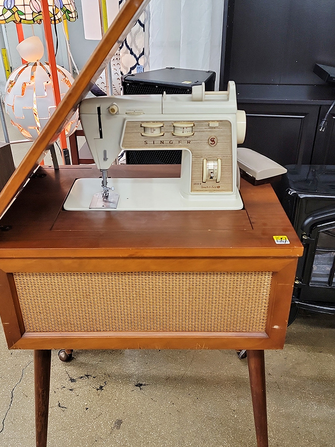 A vintage Singer sewing machine sits ready to create magic, proving that good craftsmanship never goes out of style, just out of production.