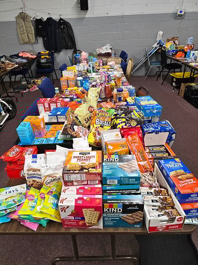 The snack vendor's table looks like someone raided a convenience store. Goldfish, KIND bars, and Cheez-Its&mdash;fuel for serious shopping expeditions.