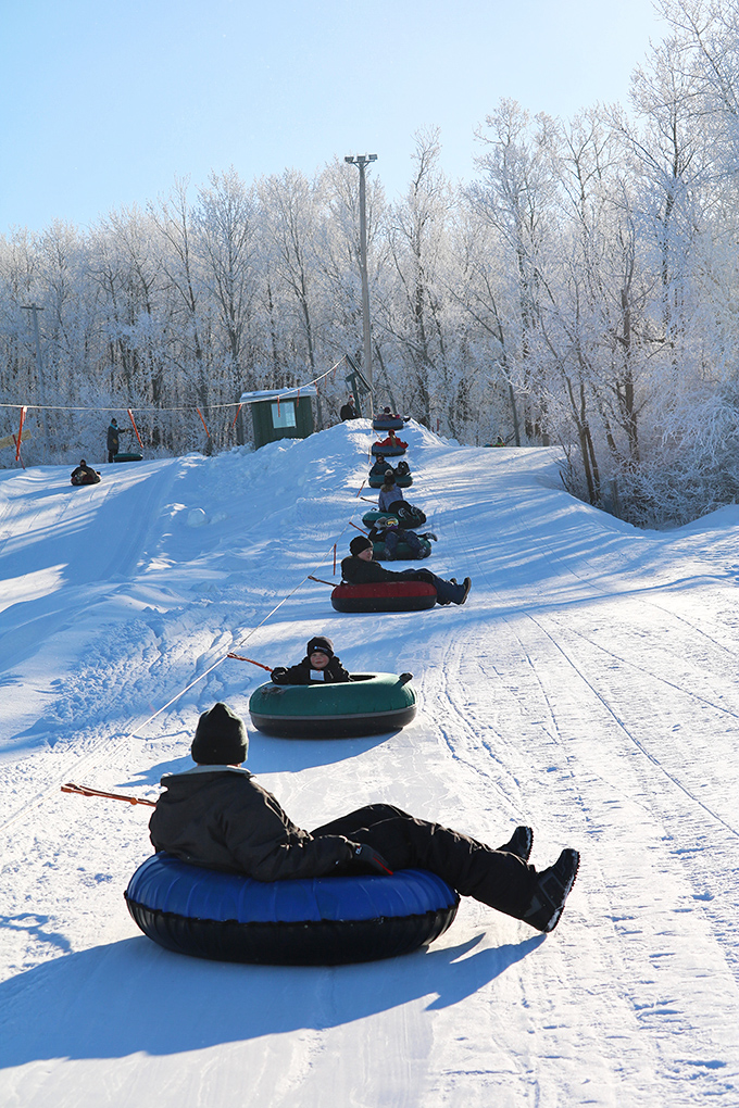 Snow tubing: where adults rediscover their inner eight-year-old and learn that gravity is still undefeated after all these years.