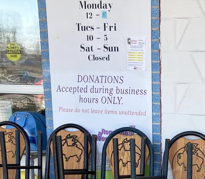 The store hours sign tells the tale &ndash; a reminder that even thrift store magic operates on a schedule, with donations welcome during business hours.