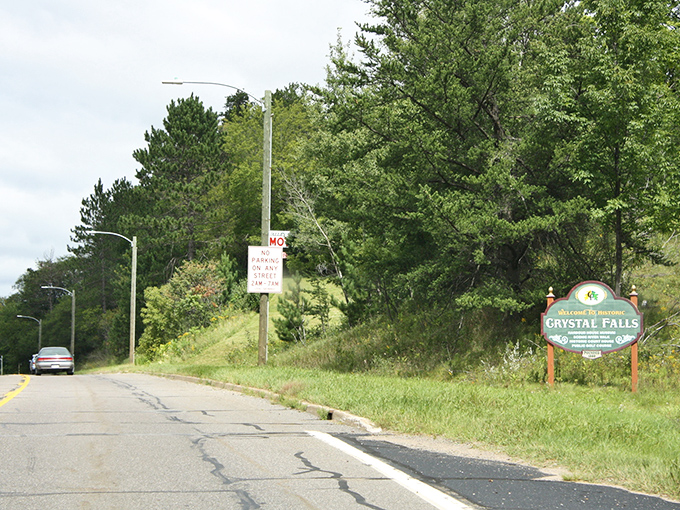 No flashy neon or digital billboards here&mdash;just a simple wooden welcome sign that perfectly captures the town's unpretentious charm.