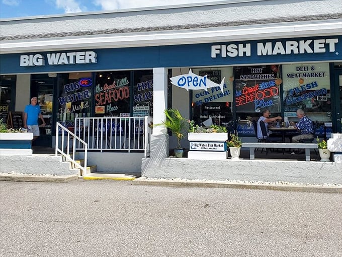 Big Water Fish Market's neon-bright storefront is like a lighthouse guiding hungry sailors to seafood salvation.