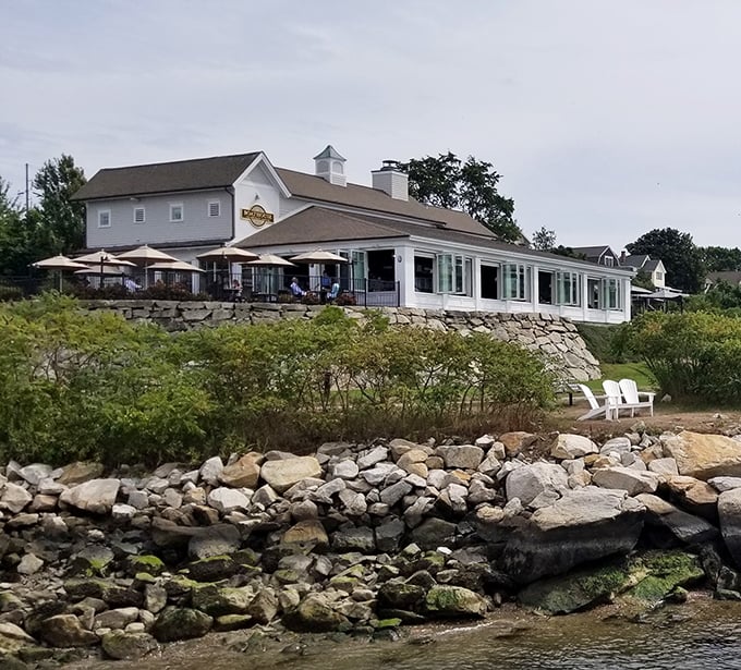 The Boat House perches majestically above rocky shores &ndash; where architectural elegance meets culinary excellence on Tiverton's waterfront.