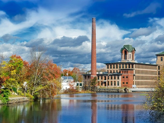 Coventry's historic mill buildings reflect beautifully in the calm river waters on this gorgeous autumn day in Rhode Island.