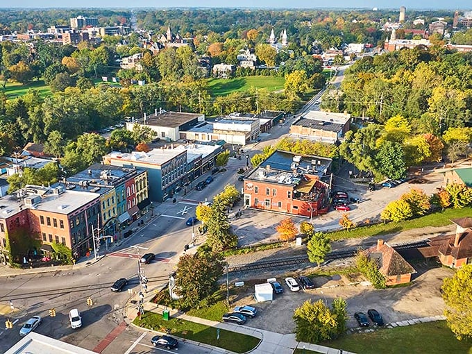 Hillsdale's charming downtown surrounded by autumn trees and historic buildings, where small-town affordability meets college-town charm.