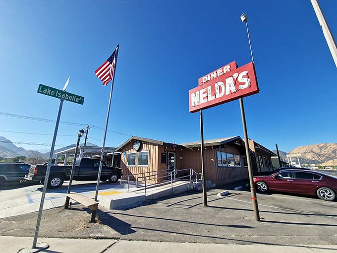 Nelda's Diner with the American flag flying high and mountains behind – it doesn't get more American than this!
