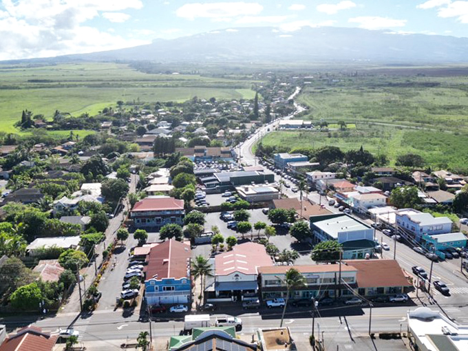 Paia nestles between lush green fields and mountains, a charming small town where Maui's north shore community thrives.