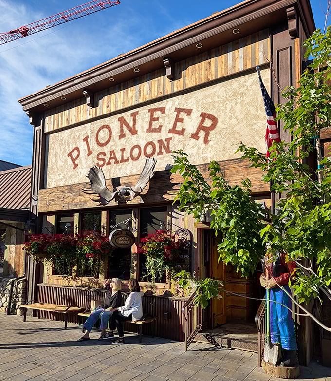 The Pioneer Saloon's western facade and wooden benches transport you to an era when cowboys ordered their steaks rare.