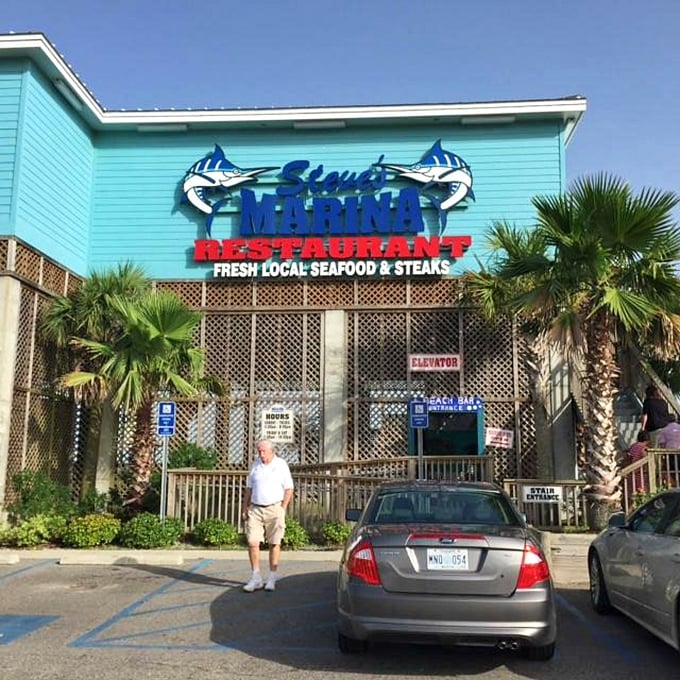 Steve's Marina's blue exterior and marlin signage—like a billboard from Neptune himself advertising ocean treasures.
