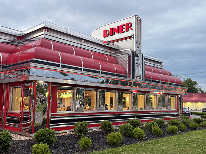 Chrome and red neon gleaming against the sky—the Sunliner doesn't just serve food, it serves pure Americana on a shiny platter.