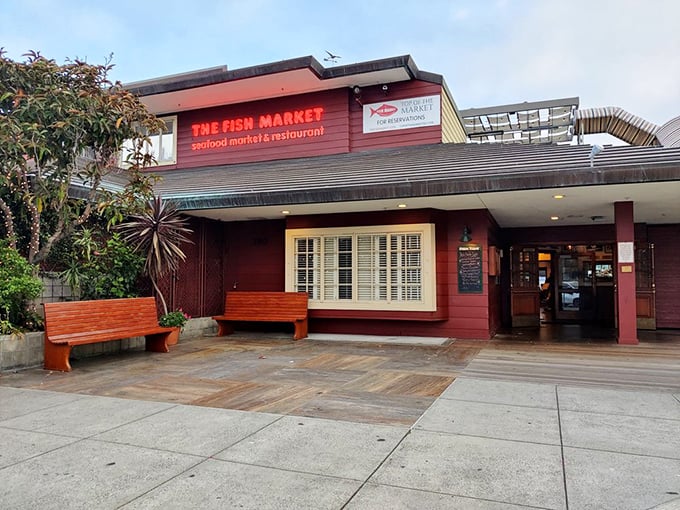 The Fish Market's rustic red exterior stands out like a lighthouse for hungry sailors. San Diego's seafood beacon has been calling folks home for decades.