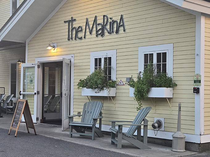 The Marina's cheerful entrance and colorful planters hint at the beachy, laid-back vibes waiting inside.