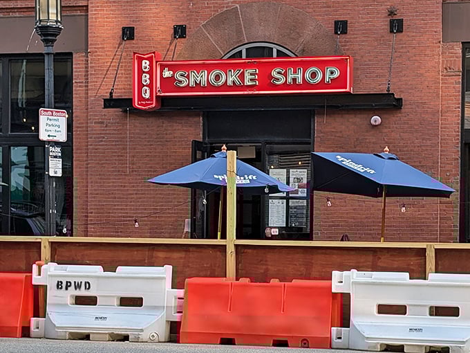 The Smoke Shop entrance: Behind this brick fa&ccedil;ade and bold red sign lies a temple of smoke where city slickers find BBQ enlightenment.