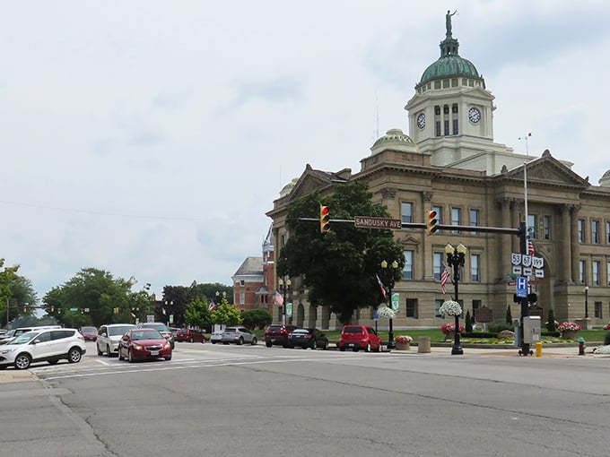 Upper Sandusky's impressive brick courthouse commands attention, a testament to small-town pride and architectural ambition.